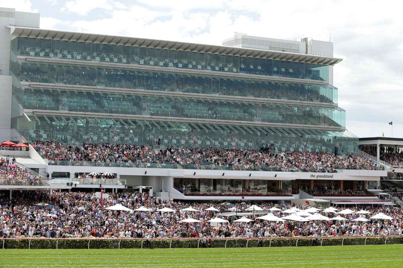 New members stand at Flemington