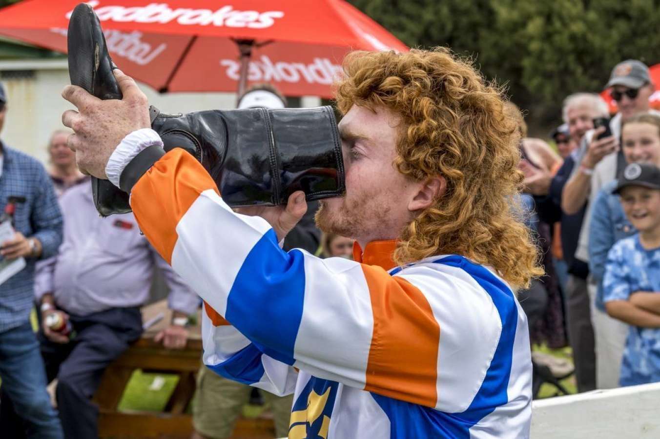 Jockey Thomas Doyle loses famous mullet after Darwin race fall